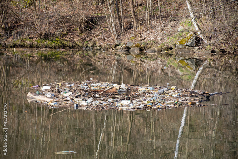 Garbage floating in the water - land water pollution Stock Photo ...