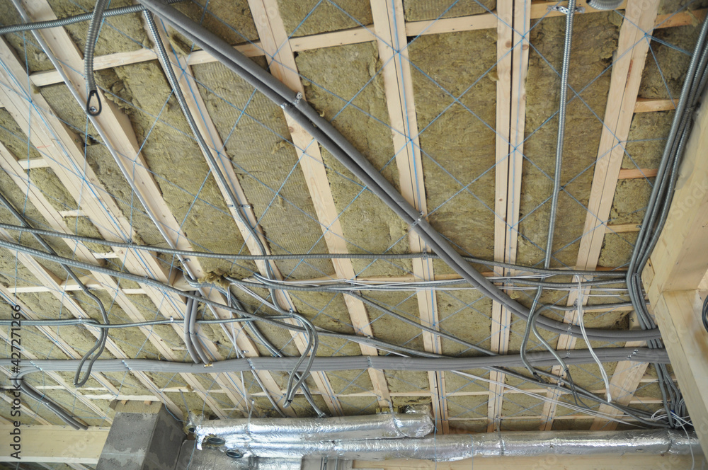 Foto de Ceiling mineral wool insulation with ventilation pipes and ...