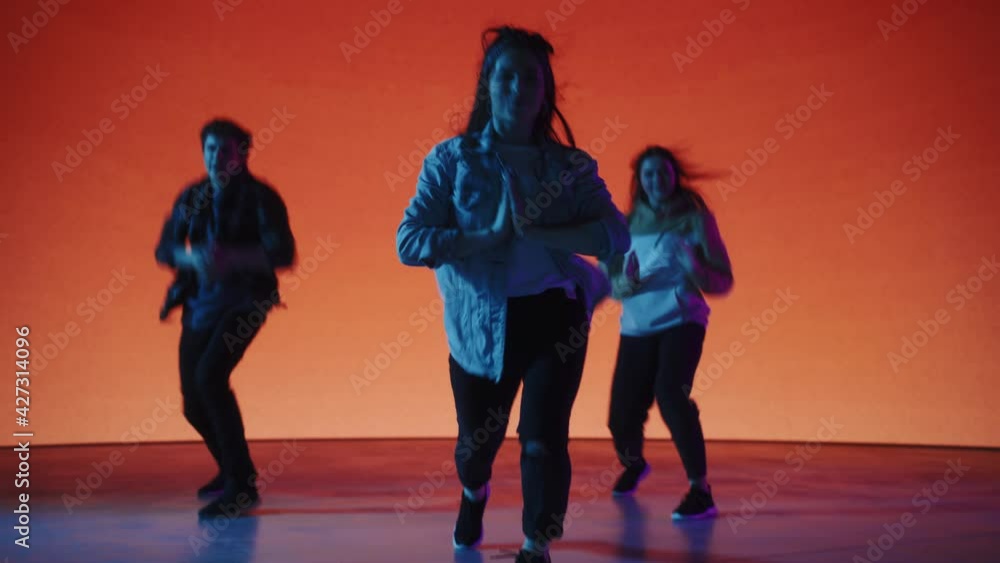 Diverse Group of Three Stylish Professional Dancers Performing a Hip ...
