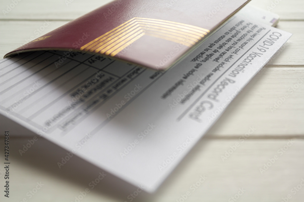 Passport and COVID-19 Vaccination record card. Immunity Passport or ...