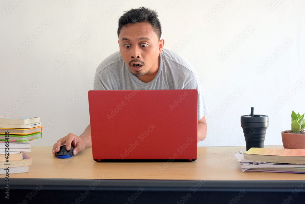 surprised man looking laptop screen isolated in white, amazed asian man ...