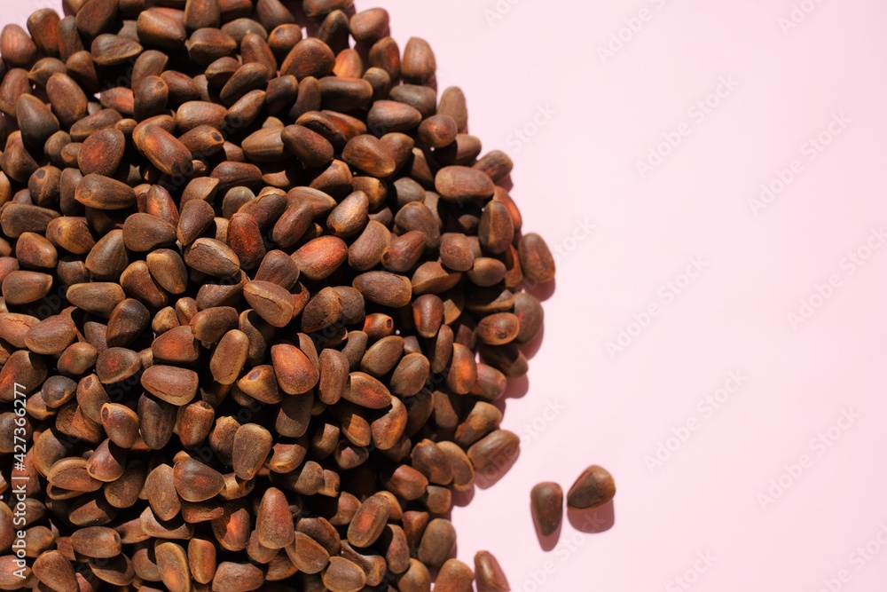 Pine nuts heap on a pink background. Nuts and seeds. cedar nuts ...