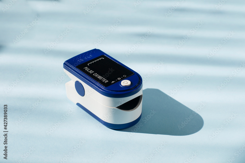 Pulse oximeter device for measuring oxygen in the blood on a blue ...