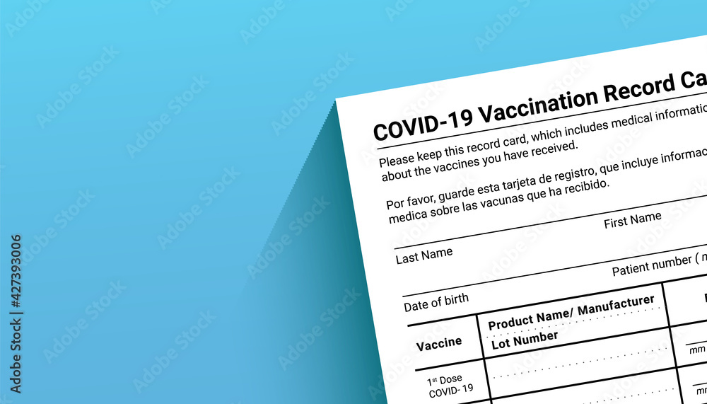 Coronavirus vaccination record card on a blue background with copy ...