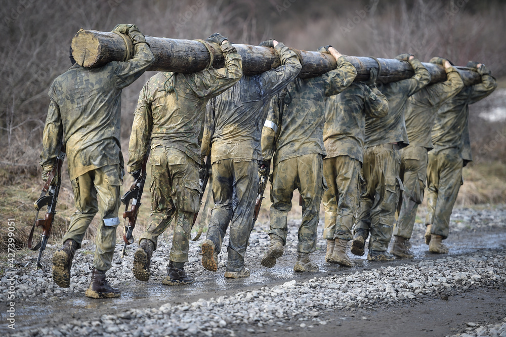 Special forces military training carrying a big log. Photograph detail ...