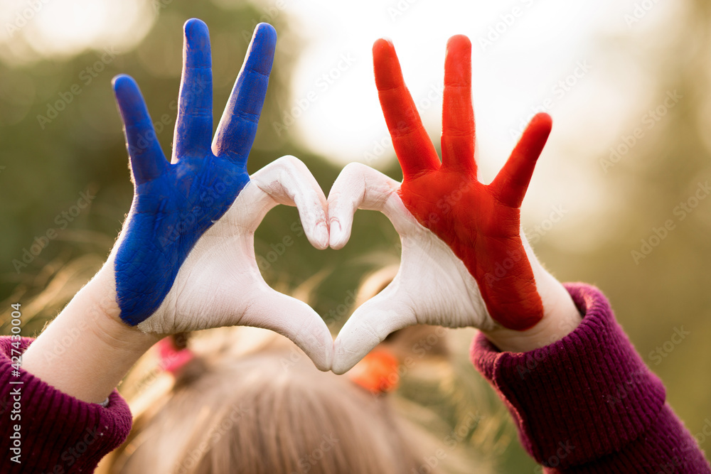 Love and happiness concept. Cute child forming heart gesture with hands ...