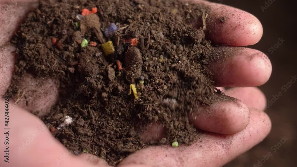 microplastics in soil. plastic waste in agricultural field. soil ...