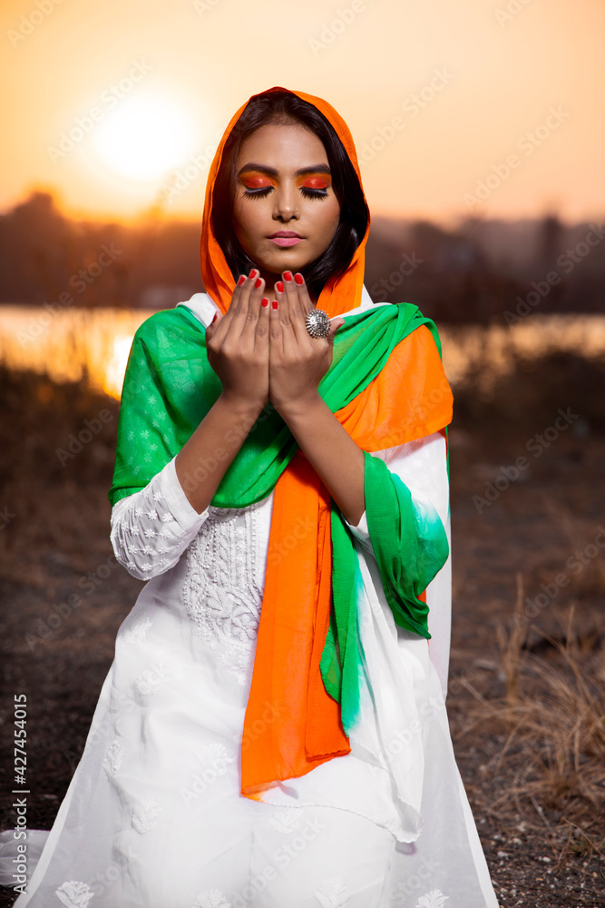 Indian beautiful Muslim woman wearing an Indian tricolor dupatta ...