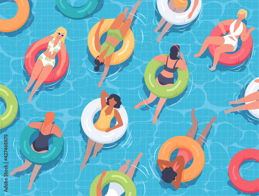 Beautiful women swimming in the pool with colorful lifebuoys Stock ...