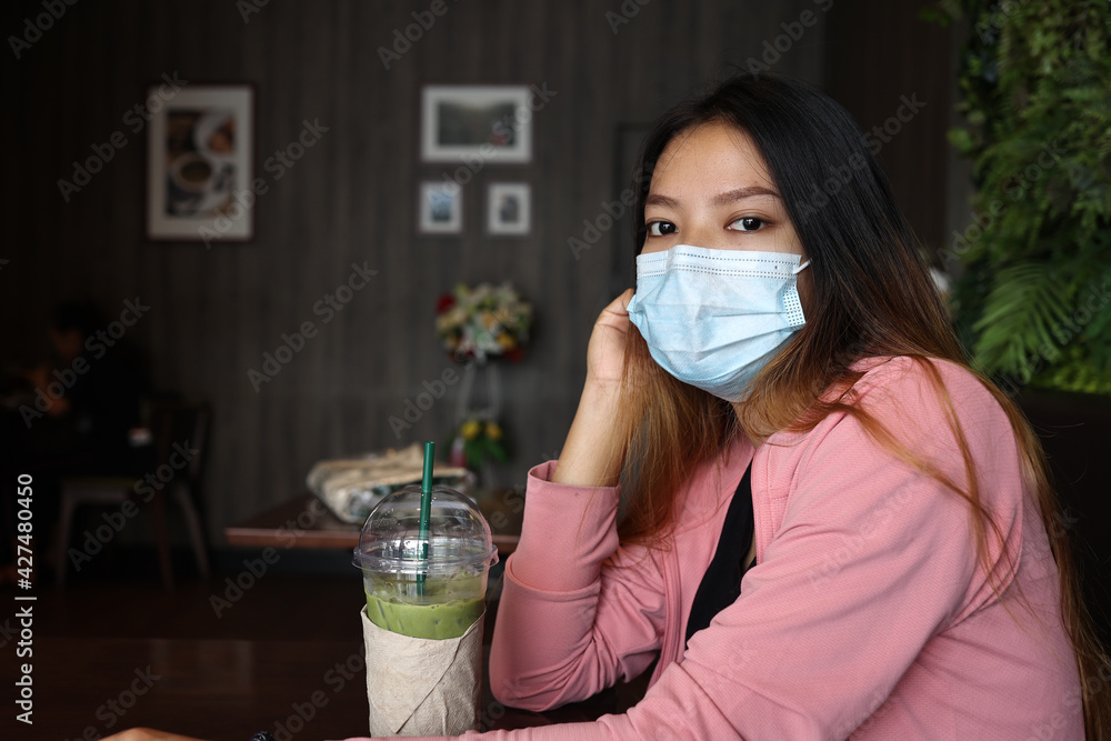 Asian girl wearing mask in the coffee cafe at Bangkok,Thailand. Asian ...
