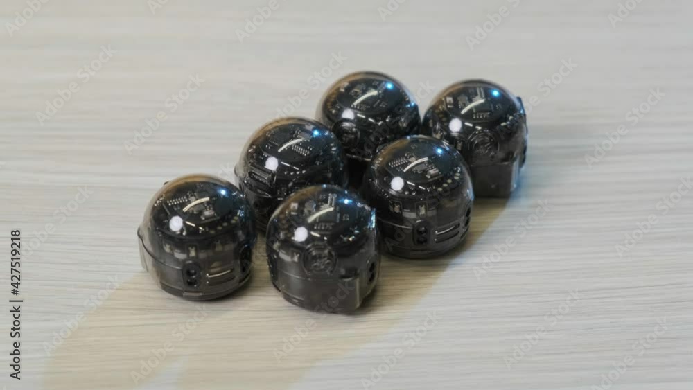 Close up of a six mini robots for the next generation of creators. Man ...