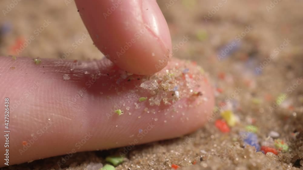 pieces of microplastic on the finger. primary and secondary ...