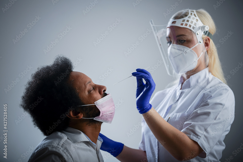 Nurse Making PCR Covid-19 Test For Black Man, White Background Stock ...