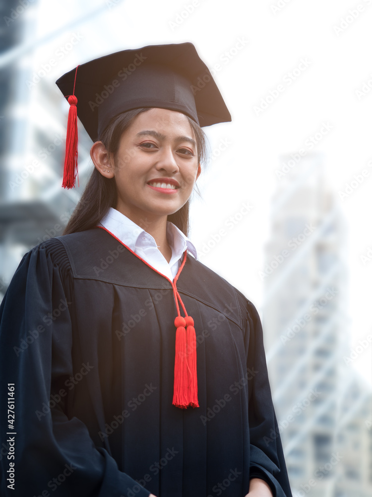 Female graduation student wearing mortar board with tessel Education ...