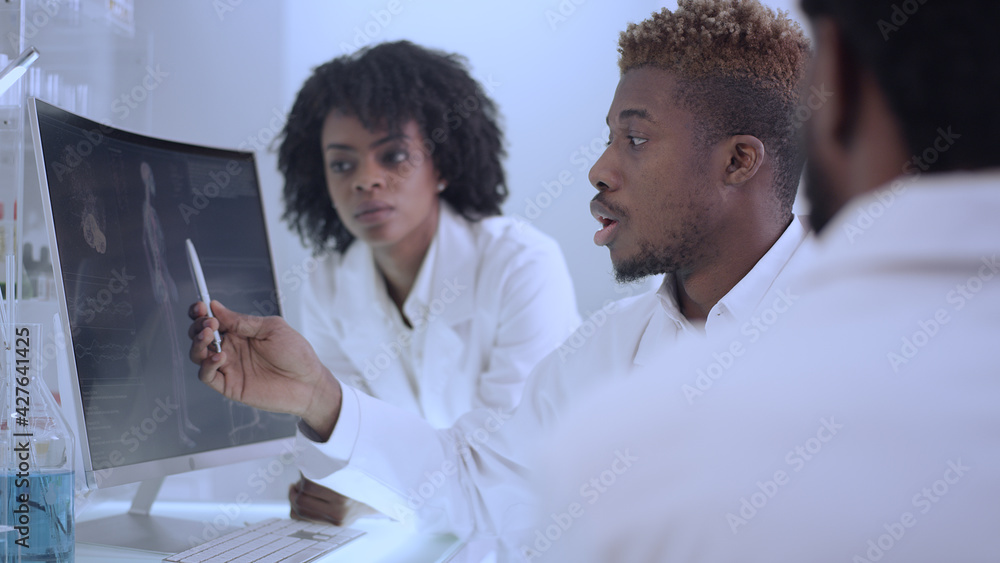 African ethnicity doctors working in laboratory. Studying human ...
