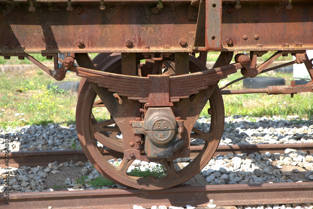 wagon wheels , old train, old wagon ,in an abandoned station. Stock ...