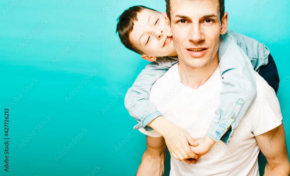 young pretty man model with little cute son playing together, lifestyle ...