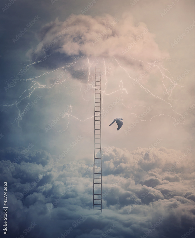 Silhouette of a fallen angel crashing down from heaven alongside a huge ...