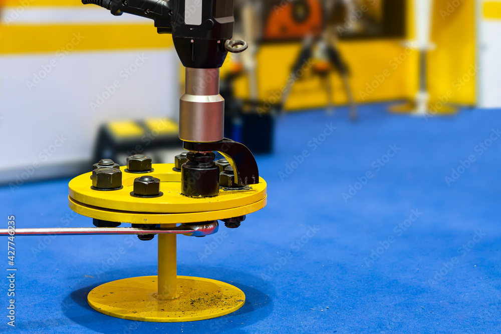 close up digital electric torque wrenches and combination wrench during ...