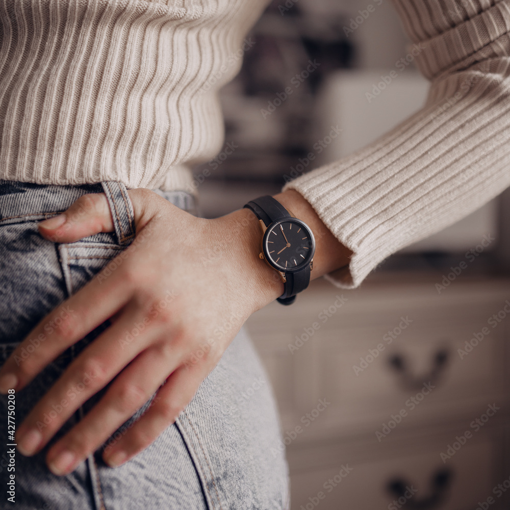 Stylish beautiful black watch on woman hand Stock Photo | Adobe Stock