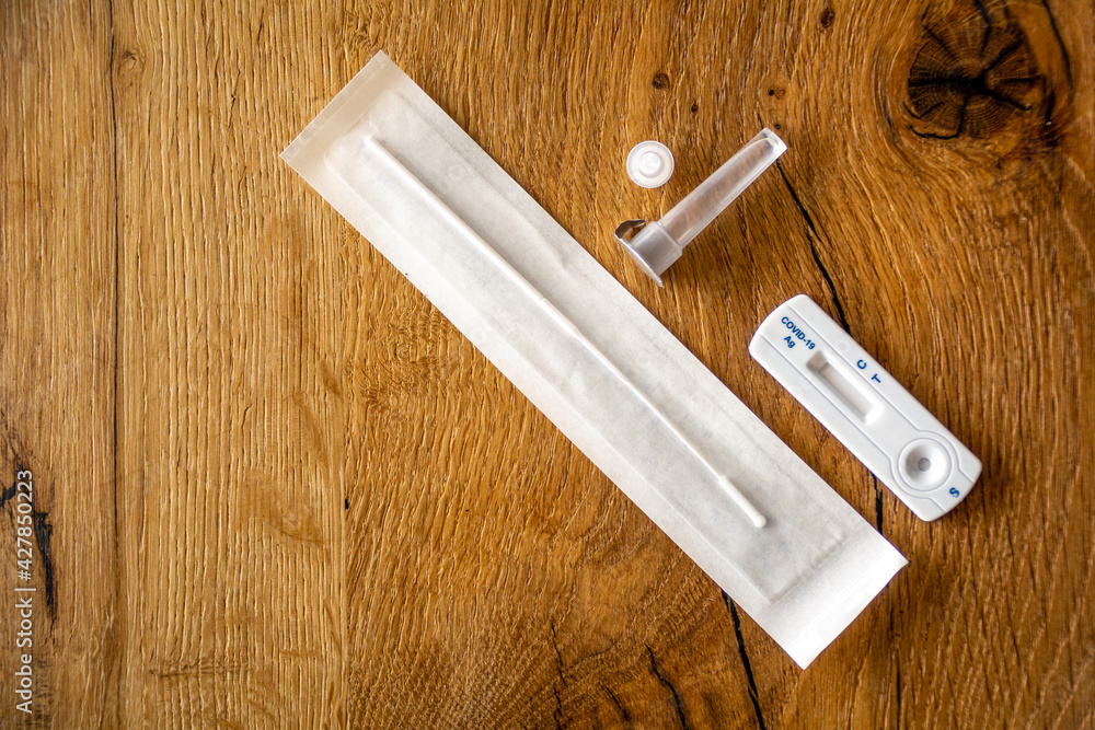 COVID-19 Rapid Antigen Test kit on a wooden table, ready to be used ...