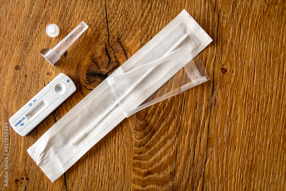 COVID-19 Rapid Antigen Test kit on a wooden table, ready to be used ...