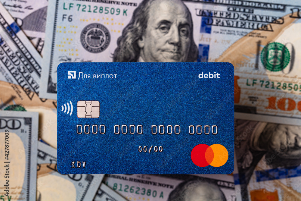 Debit card and US 100 dollar banknote Stock Photo | Adobe Stock