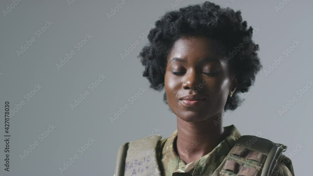 Vídeo do Stock: Head and shoulders portrait of serious young female ...