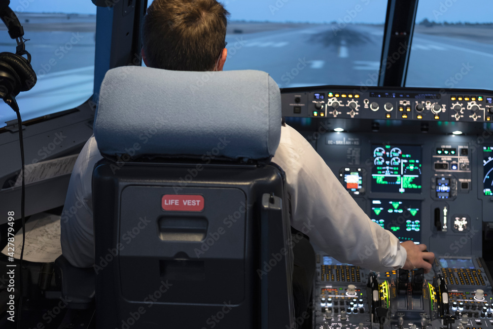 View of the cockpit of a commercial flight simulator, the take-off ...