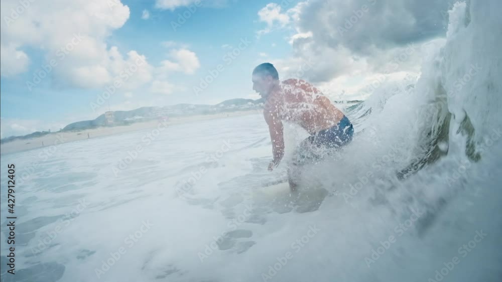 Brazilian surfer. Adult male surfer rides the ocean wave at Campeche ...