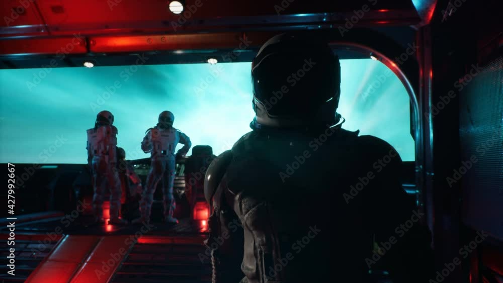 The astronaut leave the control room and walk along the corridor of the ...