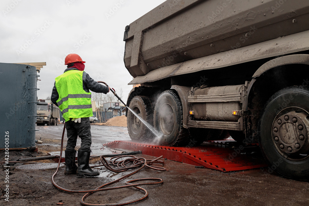 truck wheel wash at the construction site of an apartment building or ...