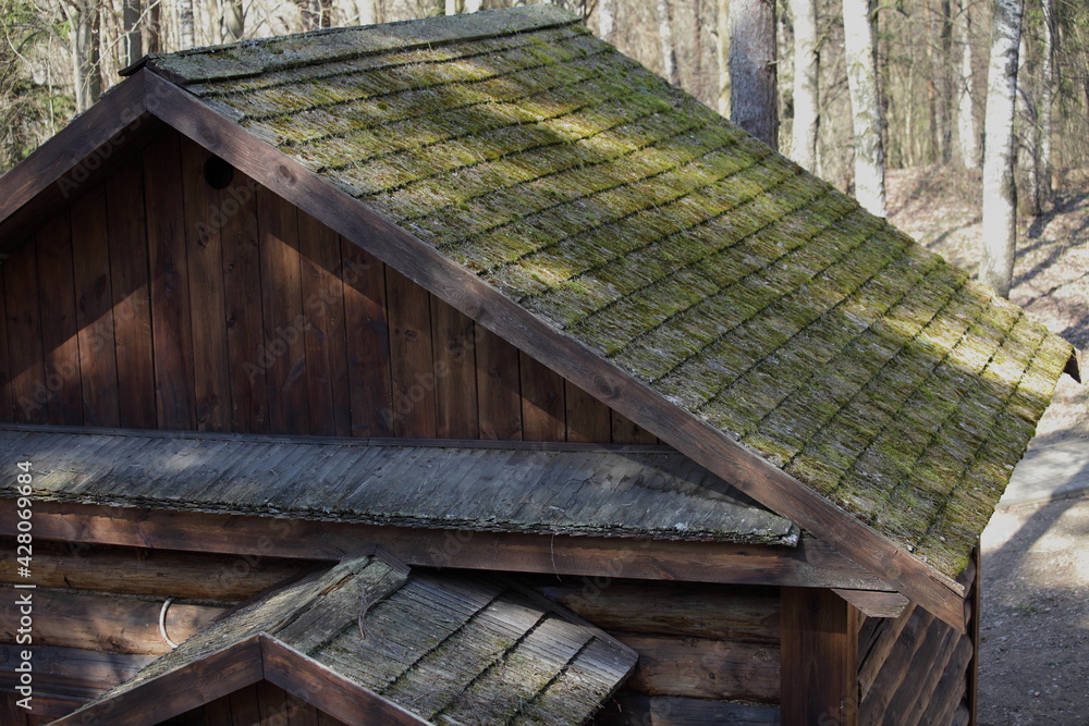Old fairy wooden tile roof with moss on traditional ancient European ...