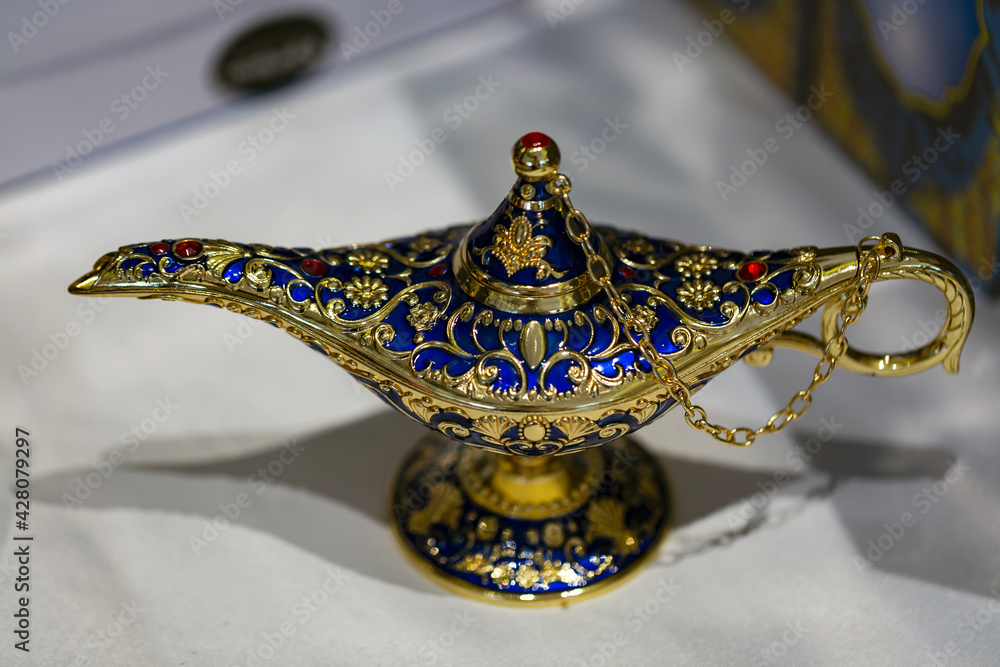 Golden magic genie lamp. lamp of desires from the story of Aladdin with ...