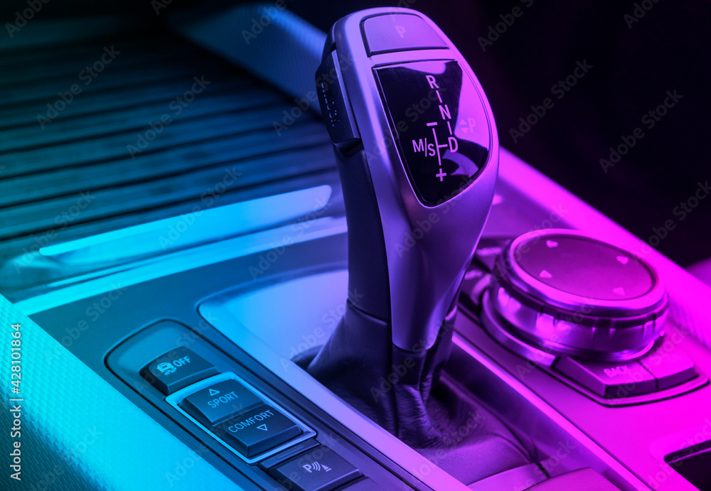 Automatic gear stick of a modern car. Modern car interior details in ...