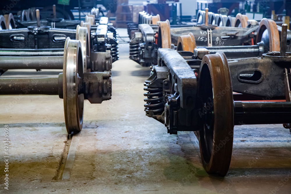 Train car-building plant. Rail car wheels and bogies. Low depth of ...