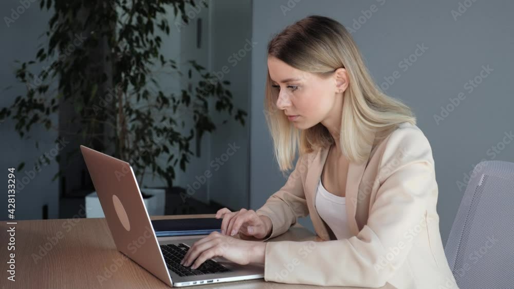 Beautiful Office Manager working typing watching checking email on ...