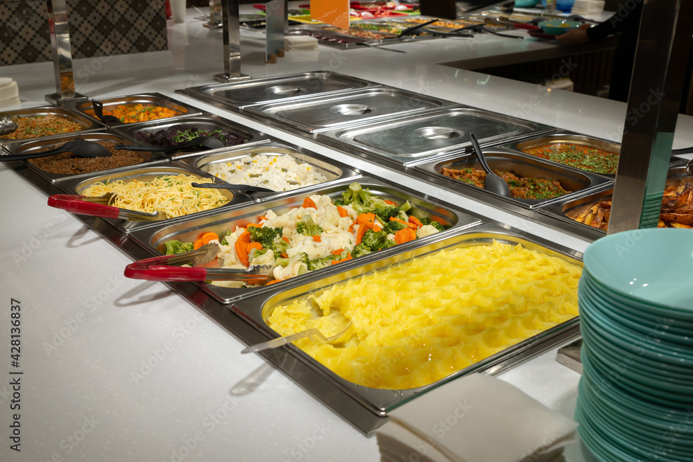Side dishes on the serving line, self-service restaurant. steamed ...