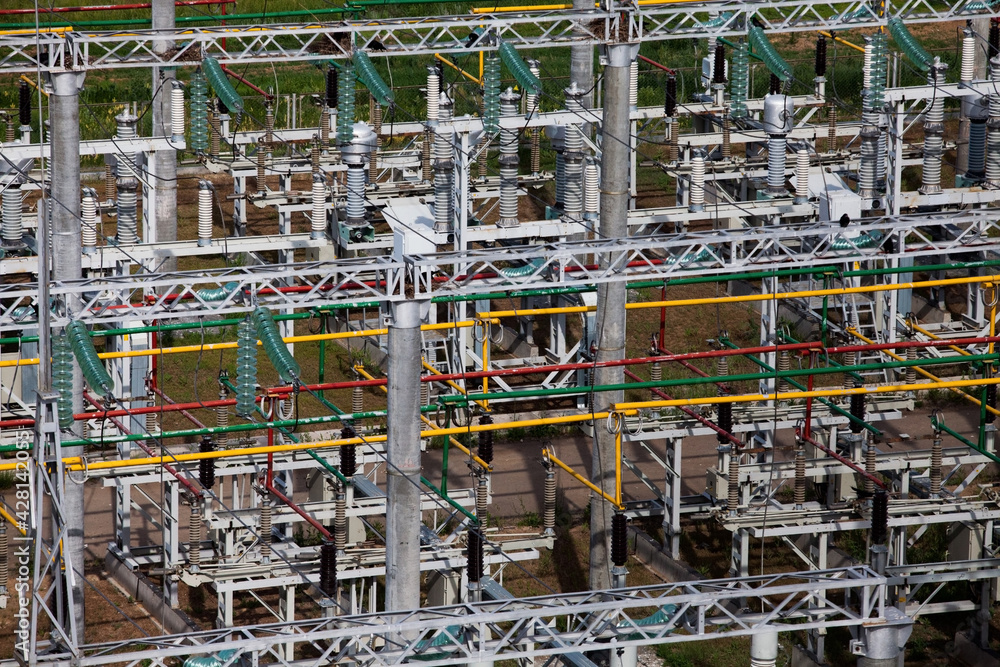 Modern high-voltage electric substation. Color wire rods (power buses ...