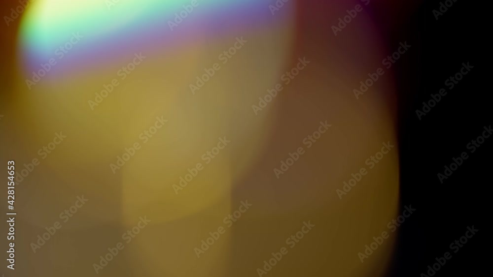 Vidéo Stock Multicolored light leaks 4k footage on black background. Lens studio flare leak ...