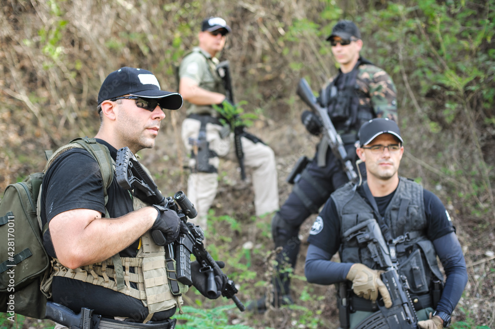 Military army soldiers in action tactical combat shooting from rifle ...