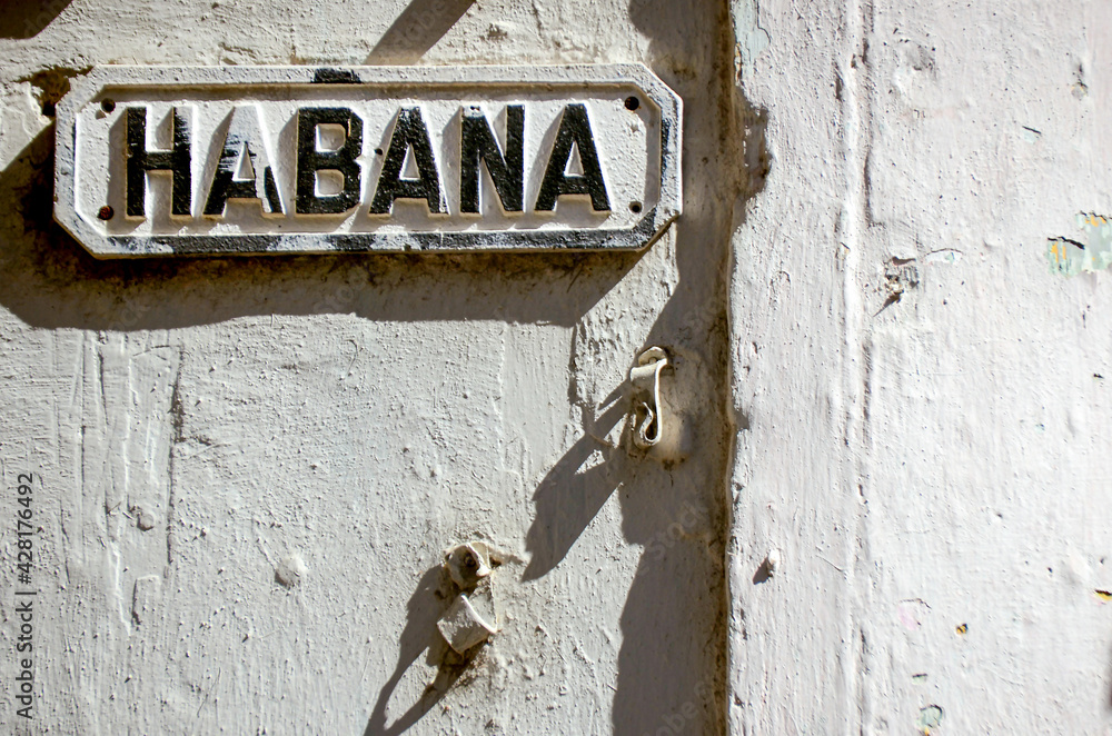 Street sign "Habana" in old Havana city in Cuba over a concrete white ...