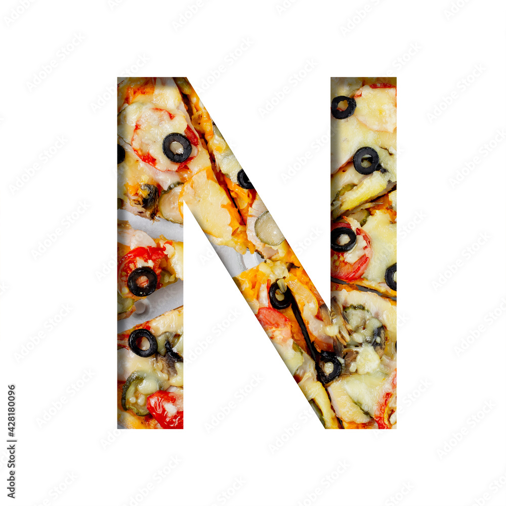 Font on pizza texture. Letter N, cut out of paper on a background of ...