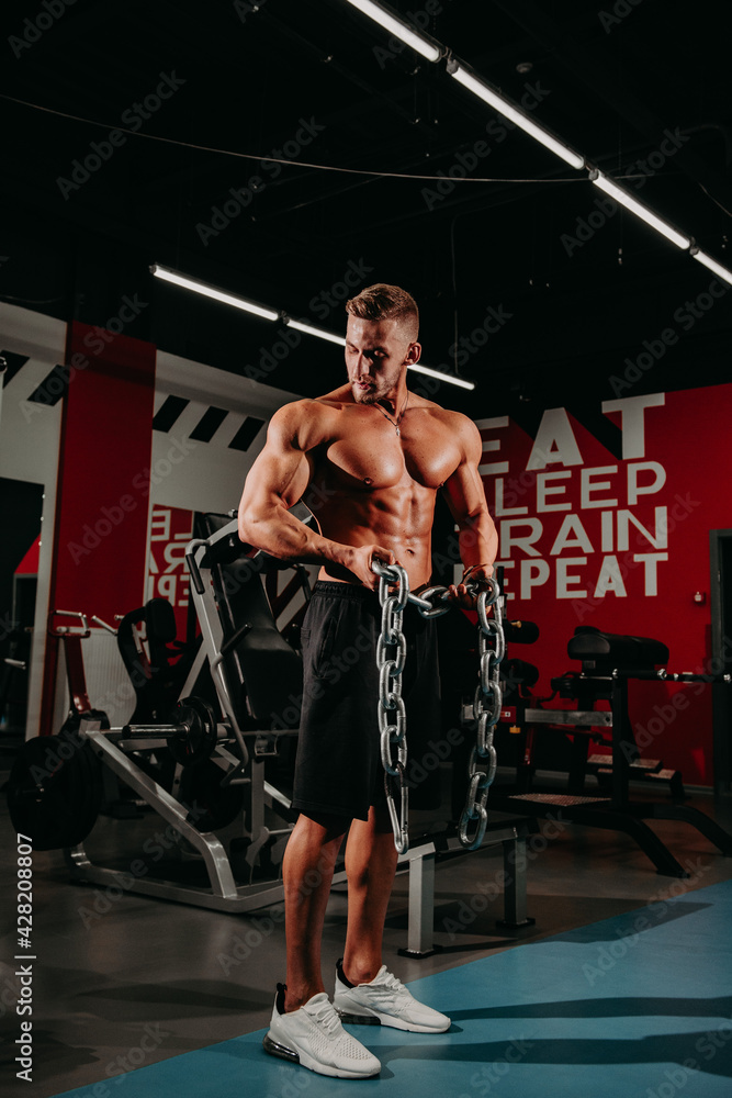 Strong bald bodybuilder with six pack. Bodybuilder man with perfect abs ...