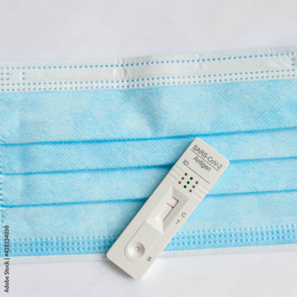 negative rapid antigen-test Covid-19 and medical mask Stock Photo ...