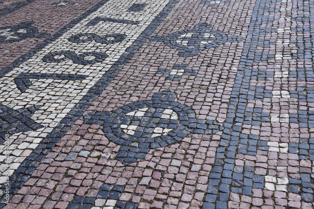 Natural granite stone paving. Pave cladding with ornamental draw. Old ...