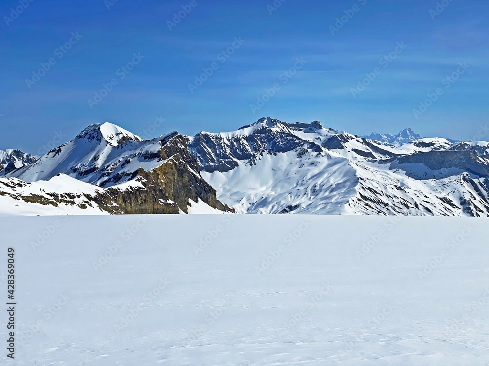 Spring icy alpine atmosphere on the Swiss mountain peaks viewed from ...