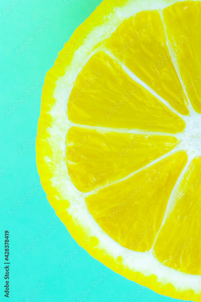 Close up photo of lemon texture on the blue background. Fruit cut in ...