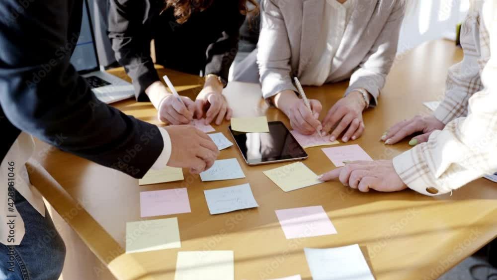 Office scene of group discussion of upcoming project. Young managers ...