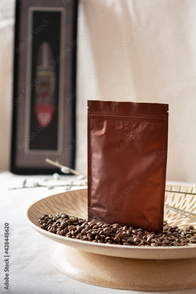 Blank coffee packaging, coffee seeds in wooden decorative plate ...